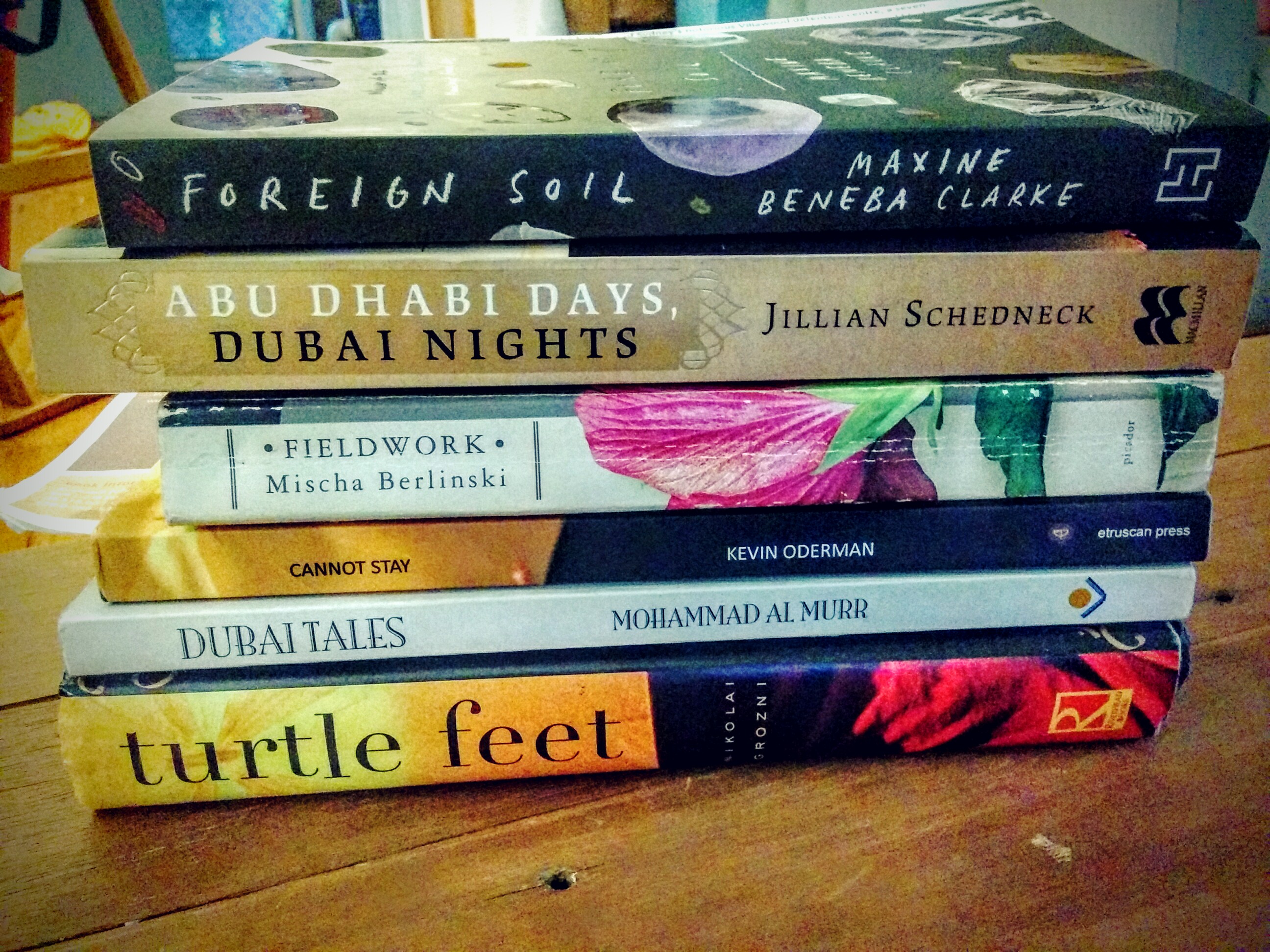 travel books stack | Writing from Near and Far